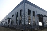 China Q235B Prefabricated Steel Frame Building System Construction for Commercial Warehouse Fast Assembly Minimal Maintenance for sale