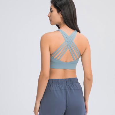 China Fashion Cross Tapes Back High Impact Push Up Unique Sports Bra Gym Wear Women for sale