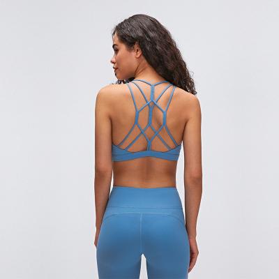 China Fitness Sexy Lulu Cross Back Padded Custom Logo Workout Women's Solid Color Sports Bra Top for sale