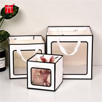 China Custom Printed Black White Luxury Shopping Gift Paper Bag With Handle for sale