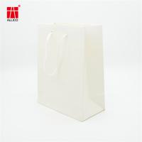 China Custom Logo Gift Bag Glossy Clothes Retail Shopping Paper Bags With Rope Handles for sale
