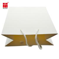 China Custom Logo Gift Bag Glossy Clothes Retail Shopping Paper Bags With Rope Handles for sale