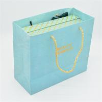China CMYK Printing Cosmetic Shopping Bag , 140g Makeup Paper Bag for sale