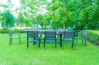 China 9 Pieces Black Plastic Wood Modern Outdoor Garden Furniture Table Set 8-10 Seater Extendable Patio Dining Table Chairs for sale