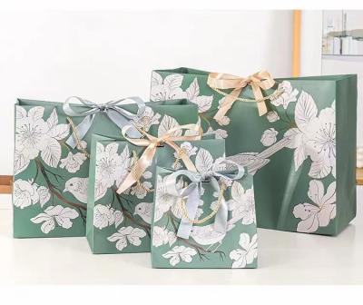 China OEM Foldable 350g Printed Paper Shopping Bag With PP Rope For Gift Shopping Packaging for sale