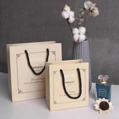 China Brown Art Printed Paper Shopping Bag With Rope Handle Recyclable for sale