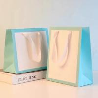 China Pink Printed Paper Shopping Bag With Ribbon Customize Logo For Gift Packaging for sale