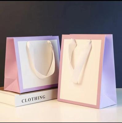 China Pink Printed Paper Shopping Bag With Ribbon Customize Logo For Gift Packaging for sale
