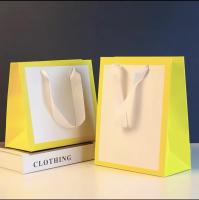 China Pink Printed Paper Shopping Bag With Ribbon Customize Logo For Gift Packaging for sale