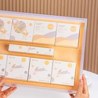 China Orange Coated Paper Foldable Gift Boxes With Ribbon Inserter Food Packaging for sale