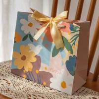 China Colorful Art Paper Printed Paper Shopping Bag For Clothing Gift Packaging for sale