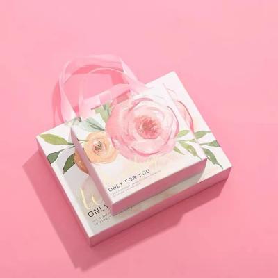 China Pink Art Paper Paperboard Gift Boxes With Ribbon Handle For Jewelry Packaging for sale