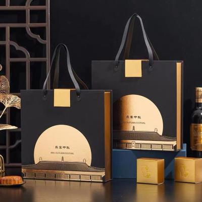 China Black Art Paper Magnetic Closure Gift Box Packaging With Rope Handle Printing Logo for sale