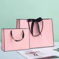 China Colorful Printed Paper Shopping Bag With Ribbon Handle Clothing Packaging for sale