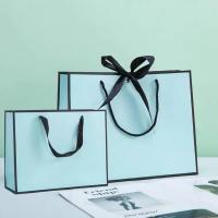 China Colorful Printed Paper Shopping Bag With Ribbon Handle Clothing Packaging for sale