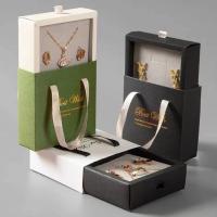 China Green Color Art Paper Paperboard Gift Boxes With Ribbon Handle EVA Inserter Jewelry Packaging for sale