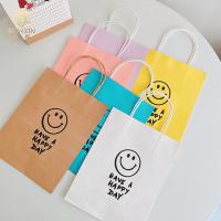 China 26cm Height Coated Yellow Paper Gift Bags Reusable With Smile Face for sale