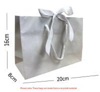 China Rope Handle Ribbon Tie Printed Paper Shopping Bag For Boutique Shop for sale