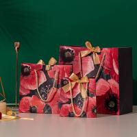 China Red Art Paper Printed Paper Shopping Bag With Ribbon Handle for sale