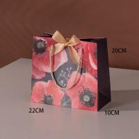 China Red Art Paper Printed Paper Shopping Bag With Ribbon Handle for sale