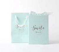 China Cosmetic Package Coated Paper Foldable Box With Ribbon Hot Stamping for sale