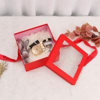 China Red Art Paper Kraft Gift Box With Window Rope Handle For Perfume Packaging for sale