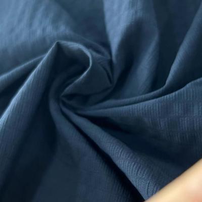 China 40D+20D*70D+40D+70D 100GSM Recycled Nylon Spandex Fabric 70D Foamed Grid Water Repellent for sale