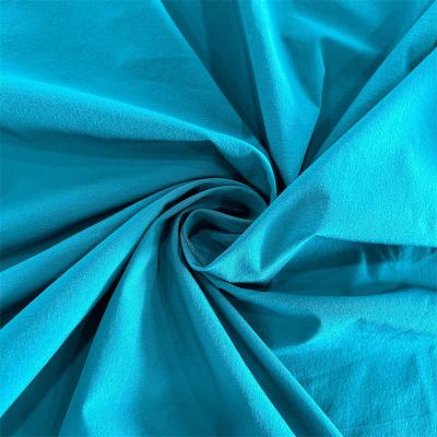 China Slightly Wrinkled Nylon Spandex Fabric Recycled 4 Way Stretch 40D+20D*40D+20D 90GSM for sale