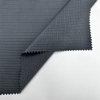 China 75D Low Elasticity T400 Hollow Grid Fabric 100% Recycled Polyester Perforated Grid Pattern for sale