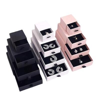 China Rigid Paperboard Jewelry Packaging Box with Custom Colors and EVA Accessory for Secure Jewelry Storage for sale