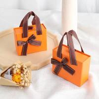 China Orange Cosmetic Paper Box Makeup Sets Ribbon Cosmetic Packaging Box for sale