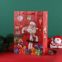 China Christmas Paper Bag Santa Claus Paper Carrier Bags With Silk Handle for sale