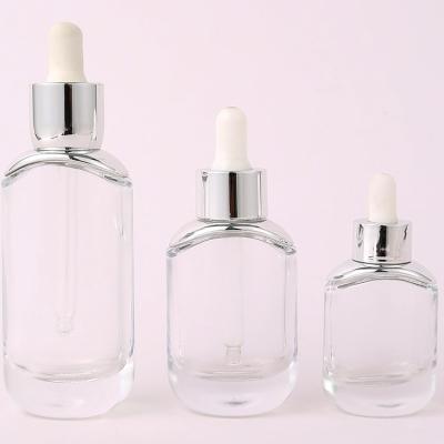 China Oval Glass Empty Dropper Bottles Clear Skin Care Essential Oil Customized Logo for sale