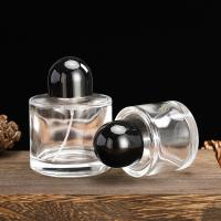 China 30ml 50ml 100ml Round Glass Perfume Bottles with Stock Fragrance Pump Spray and Empty Oil Packaging for sale