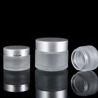 China 15g 30g 50g 100g Frosted Clear Glass Cream Jar with Gold Silver Screw Lid Customized Logo and Frosted Glass Base Material for sale