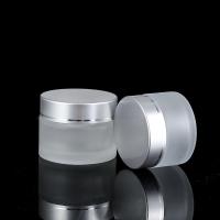 China 15g 30g 50g 100g Frosted Clear Glass Cream Jar with Gold Silver Screw Lid Customized Logo and Frosted Glass Base Material for sale