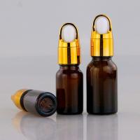 China Customized Accepted Essential Oil Small Round Empty Shiny Silver Gold Dropper Oil Bottle with Unique Flower Basket Rubber for sale