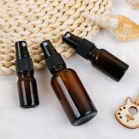 China Stock Amber Glass Spray Bottle 10ml 15ml 20ml 30ml 50ml 100ml Round Glass Empty Perfume Bottle Black Cap Cylinder Bottle Perfume for sale