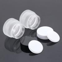 China Stock Luxury Skin Care Glass Jar 50g Empty Frosted Cosmetic Packaging with Black Lid and Glass Bottle Plastic Cap White Disc for sale