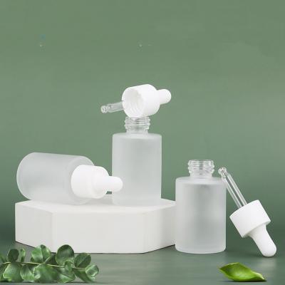 China 30ml 50ml 60ml Cosmetic Skin Care Essential Oil Essence Packaging Frosted Glass Flat Shoulder Matte Serum Dropper Bottle and Box for sale