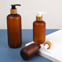 China 300ml 500ml Biodegradable Bamboo Cap Amber Matt Black PET Bottle for in Other Cosmetic Body Wash Shampoo Hair Conditioner for sale