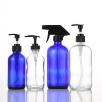 China Cobalt Blue Glass Trigger Spray Bottle 250ml 500ml 1000ml Glass Boston Lotion Bottle with Pump and Logo/Graphic Design for sale