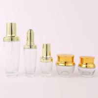 China Printing Handling Decoration Firing 100ml Glass Spray Bottle for Body Oil Economical Custom Logo Design Golden Glass Bottles for sale