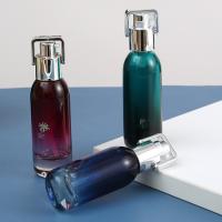 China Facial Cleanser Green Blue Glass Serum Bottle with Silver Pressure Pump 15ml 30ml 50ml Cosmetic Packaging Luxury Design for sale