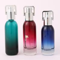China Facial Cleanser Green Blue Glass Serum Bottle with Silver Pressure Pump 15ml 30ml 50ml Cosmetic Packaging Luxury Design for sale