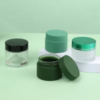 China Customized Colors Matte Black Soft Touch Blue Green Amber Glass Cream Jar With Gold Black Sliver Aluminium Cap 5g 10g 15g 30g 50g 100g for sale