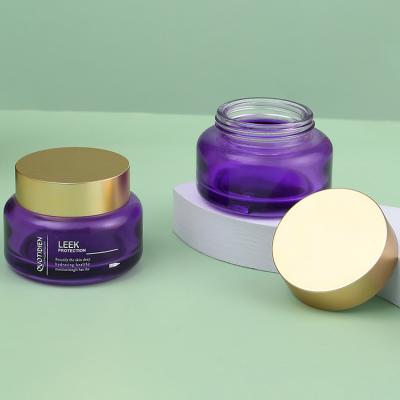 China Luxury Empty Glass Face Cream Jar 30g Refillable Body Butter Jars 1oz Cosmetic Round Purple Glass Jars with Golden Matte Lids for sale