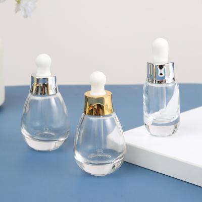 China 15ml 30ml 50ml Mini Luxury Unique Water Drop Shape Essential Hair Oil Dropper Empty Glass Bottle with Silver or Gold Dropper for sale