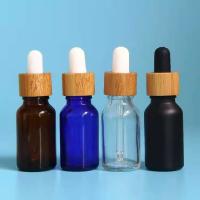 China Essential Oil Frosted Bamboo Dropper Glass Bottle in 1oz 2oz 5ml 15ml 30ml with Easy and Cosmetic Serum Box for sale