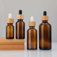 China Essential Oil Frosted Bamboo Dropper Glass Bottle in 1oz 2oz 5ml 15ml 30ml with Easy and Cosmetic Serum Box for sale